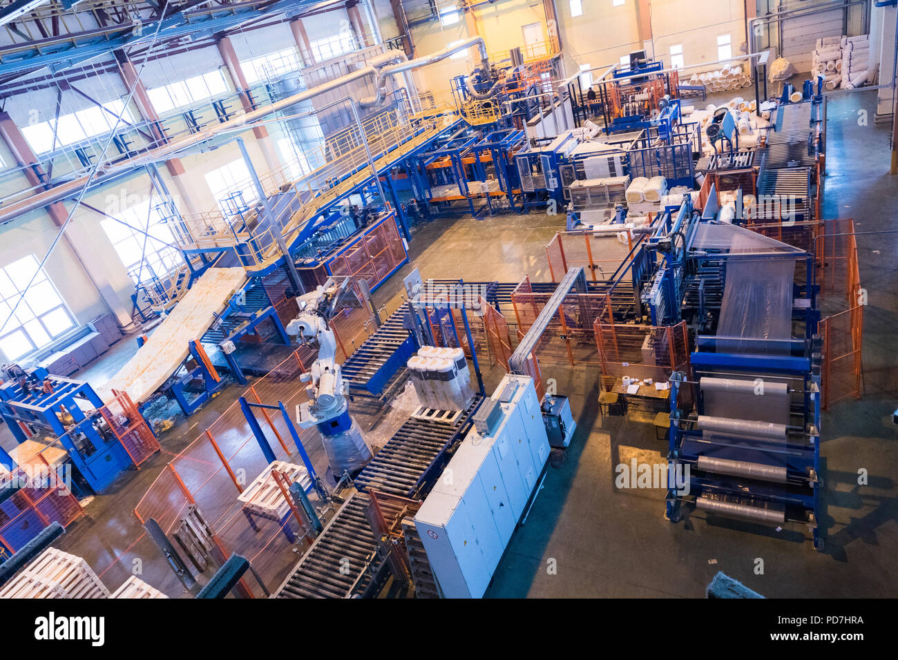 Fiberglass production industry equipment at manufacture background ...