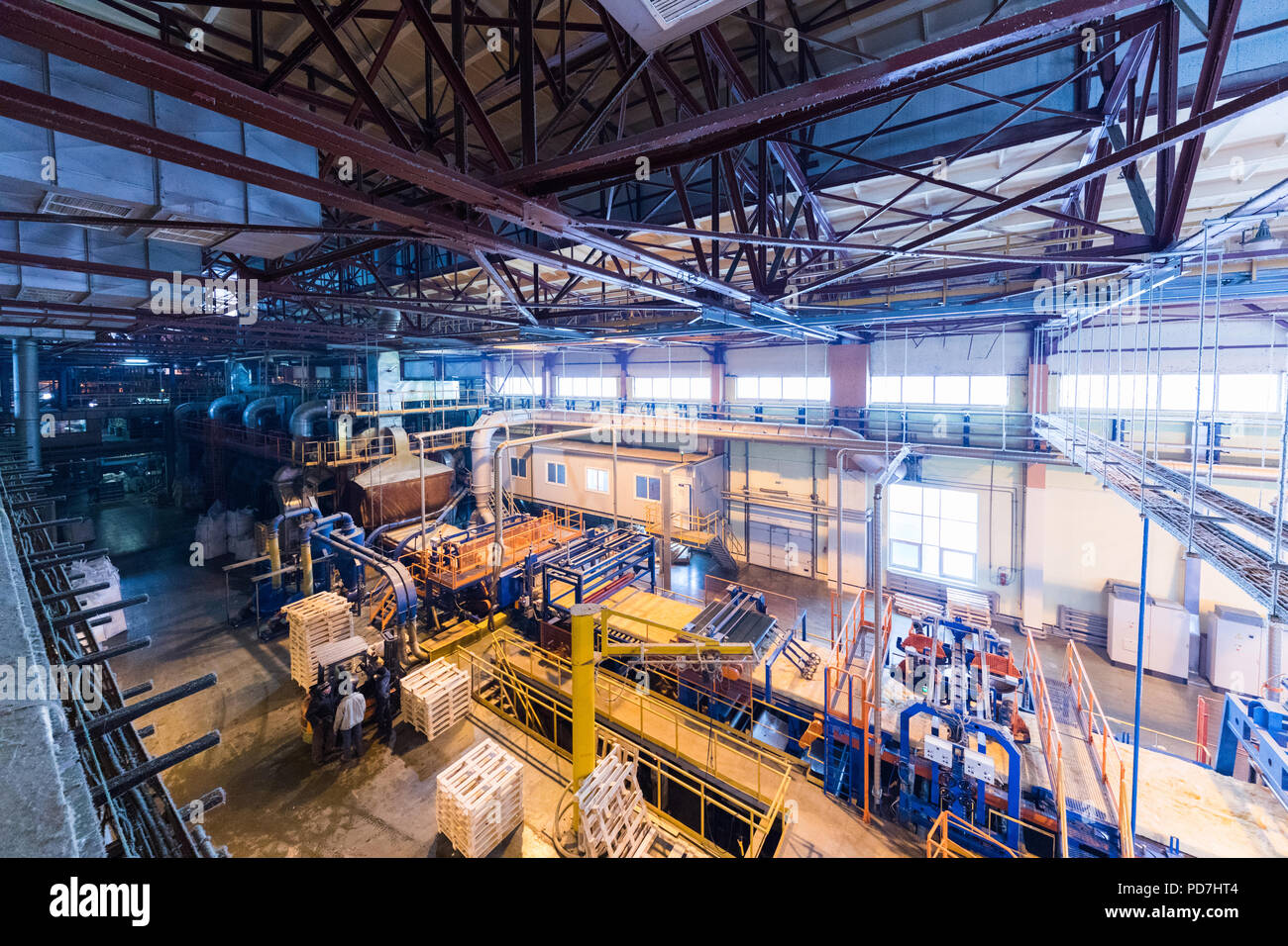 Fiberglass production industry equipment at manufacture background ...