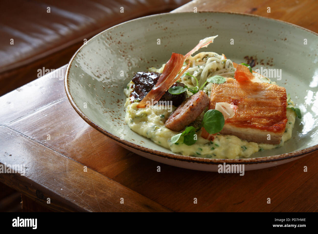 plated pork belly main Stock Photo - Alamy