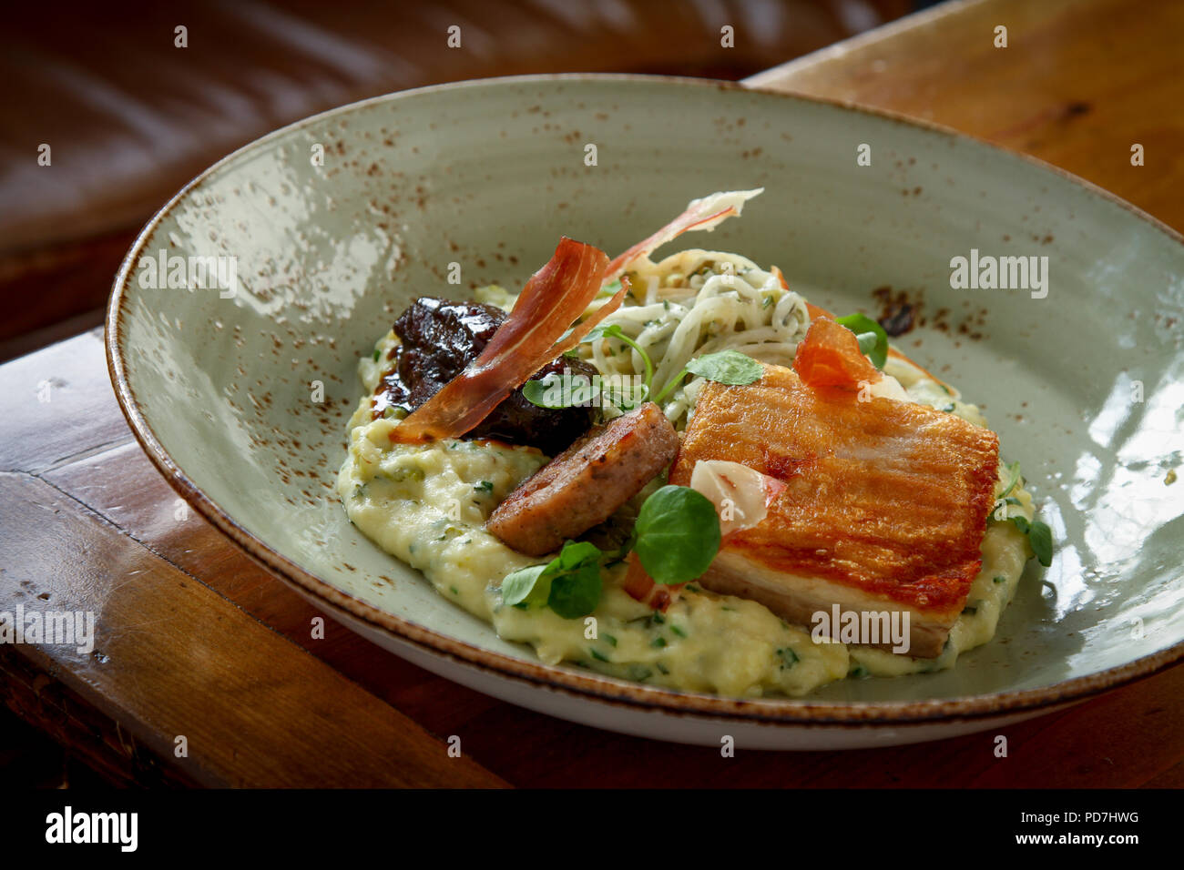 plated pork belly main Stock Photo - Alamy