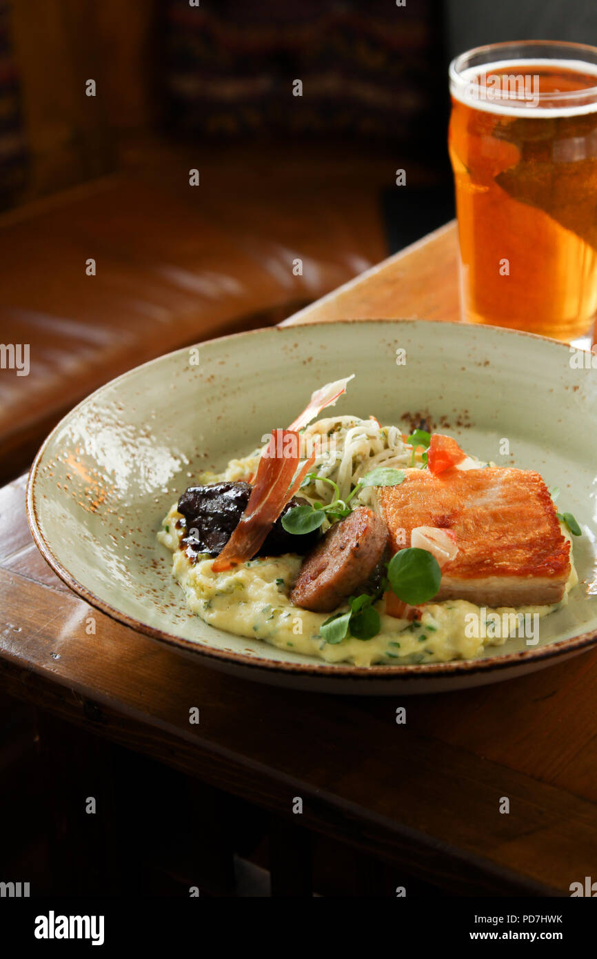 plated pork belly main Stock Photo - Alamy