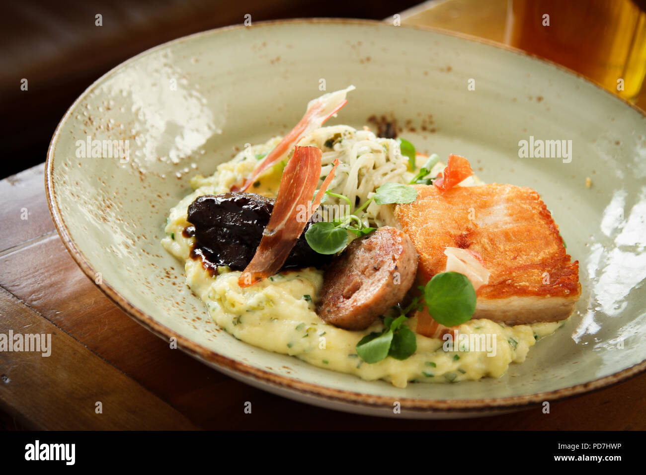 plated pork belly main Stock Photo - Alamy