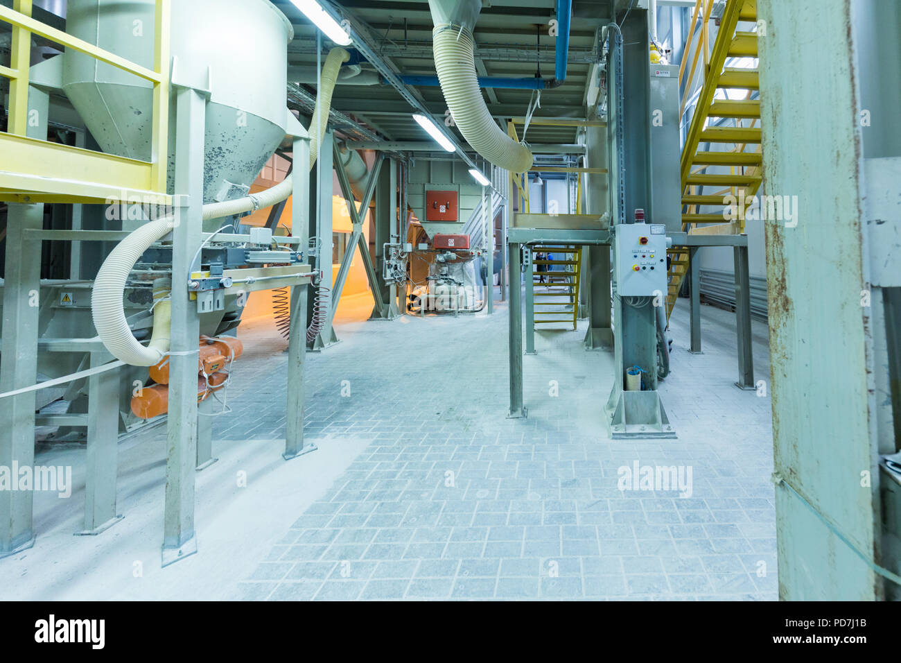 Fiberglass production industry equipment at manufacture background ...