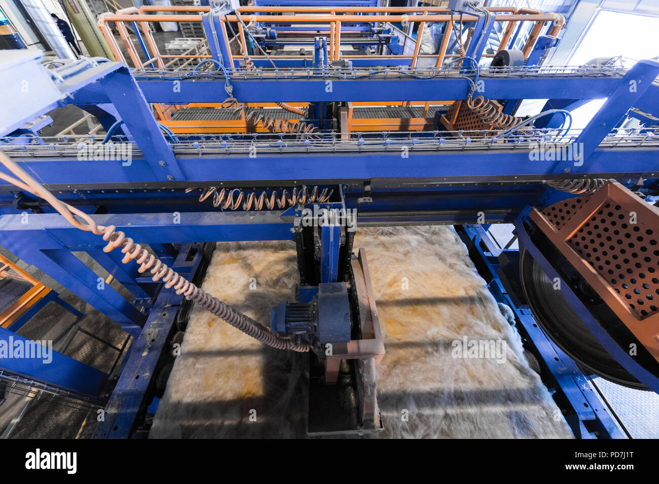 Fiberglass production industry equipment at manufacture background ...