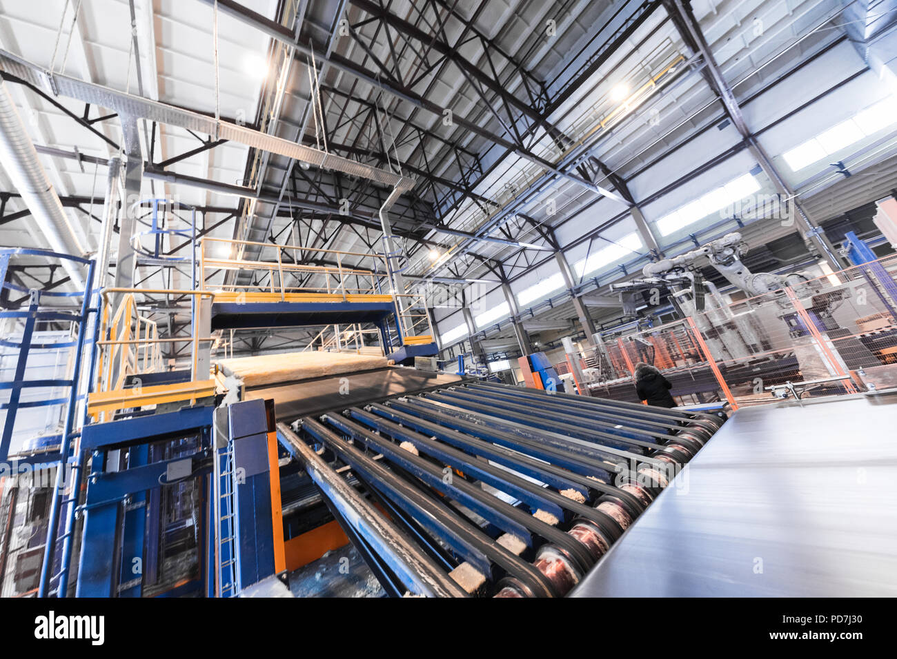 Fiberglass production industry equipment at manufacture background ...