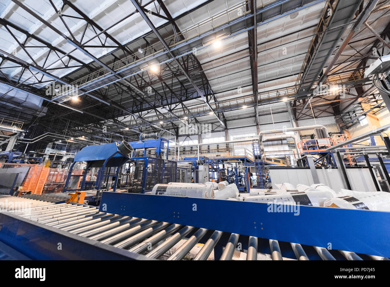 Fiberglass production industry equipment at manufacture background ...