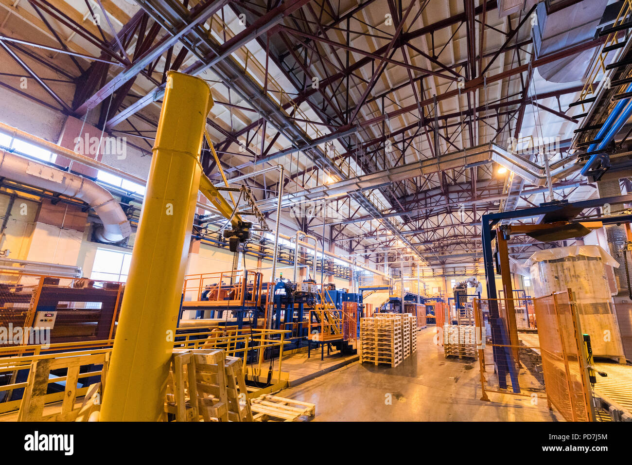 Fiberglass production industry equipment at manufacture background ...