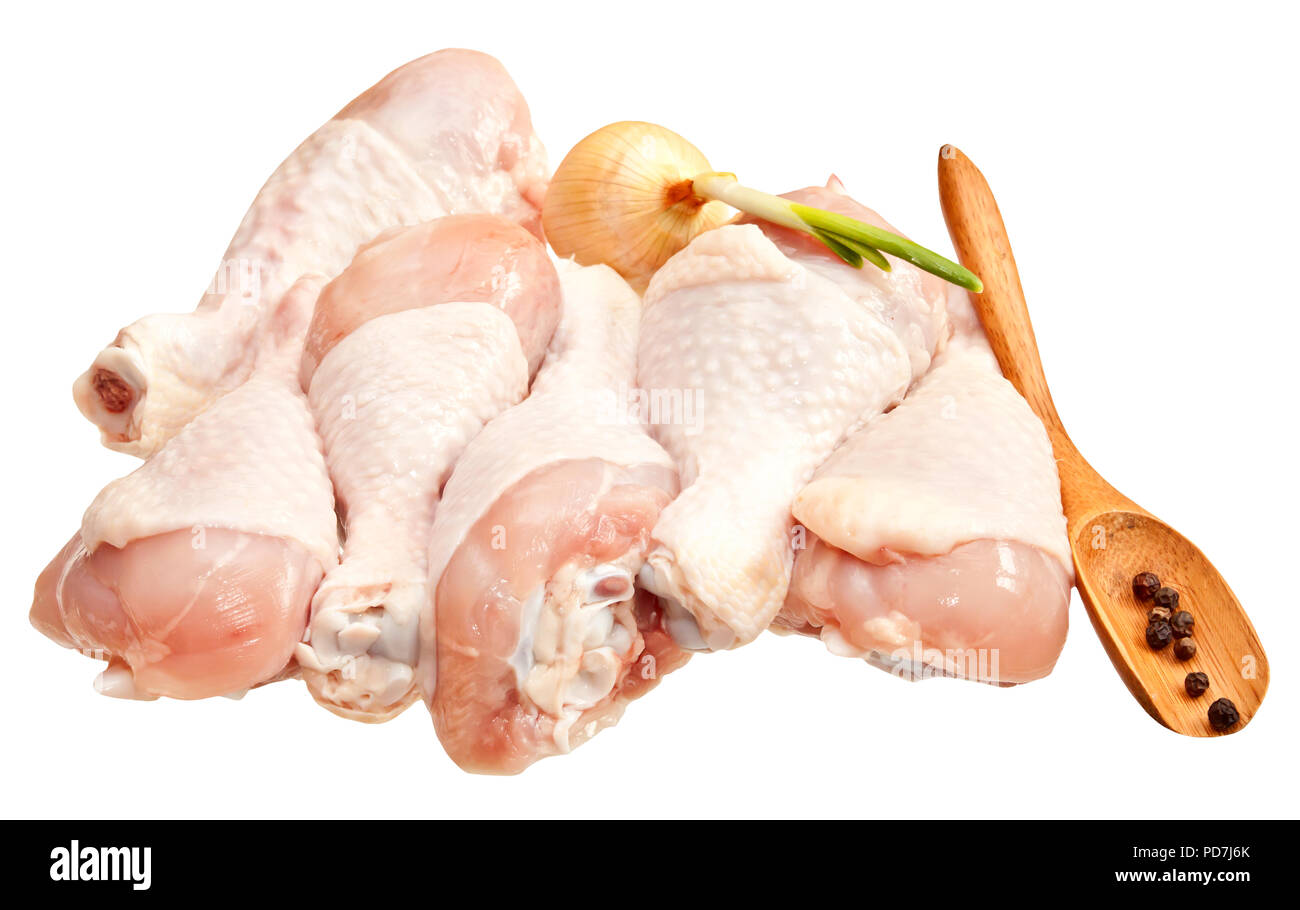 Raw chicken legs with vegetables, isolated on white background Stock ...