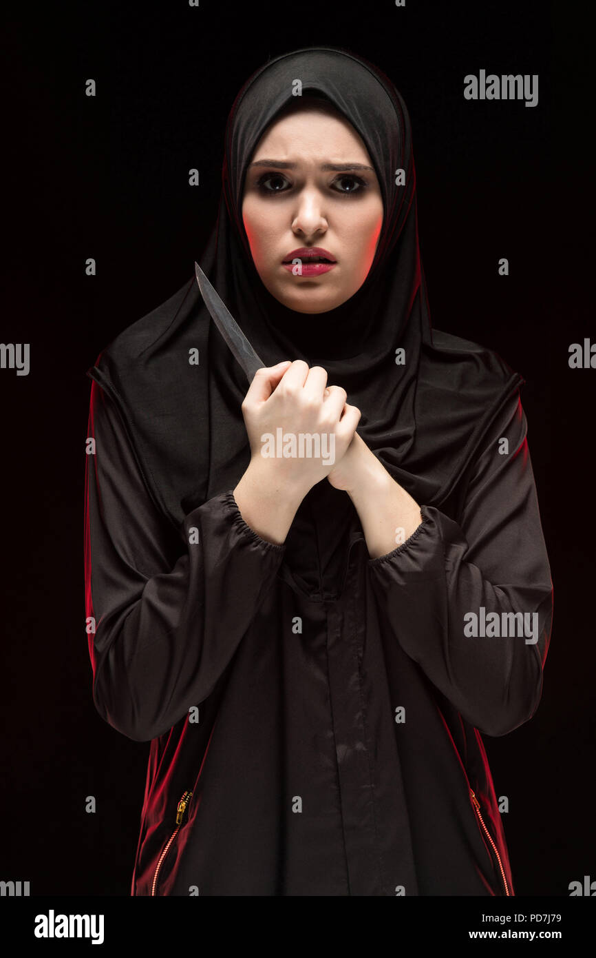 Portrait of beautiful desperate scared frightened young muslim woman ...