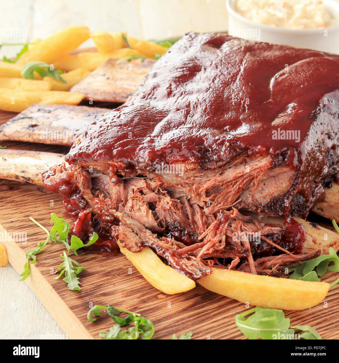 large barbecue roast beef rib with fries Stock Photo - Alamy
