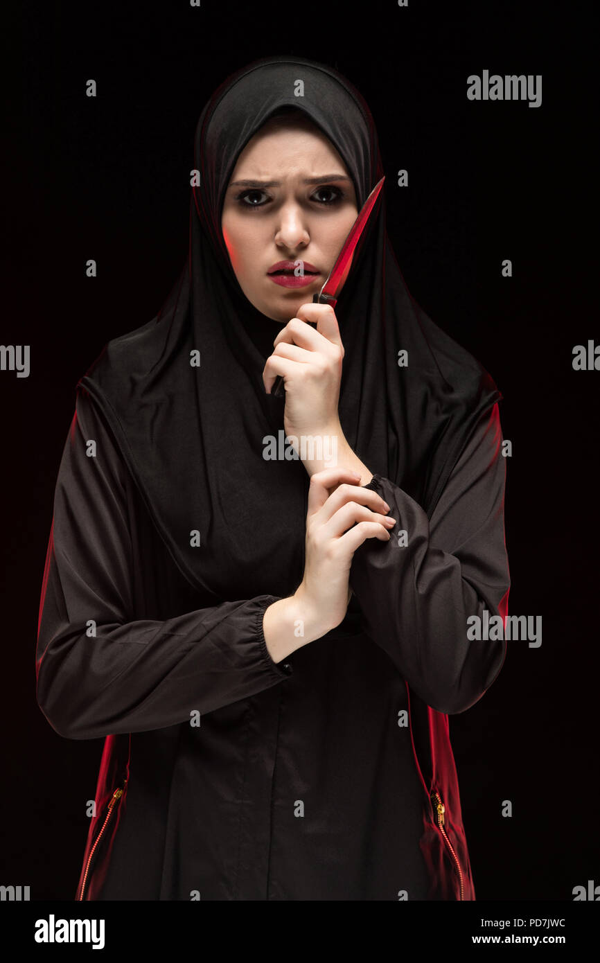 Portrait of beautiful desperate scared frightened young muslim woman ...