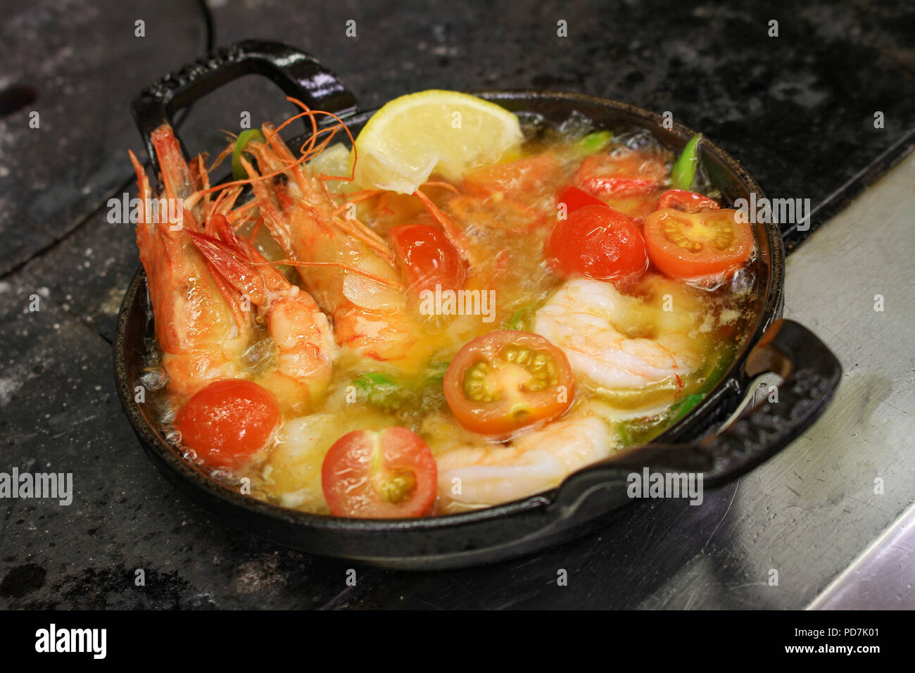 baked shellfish in sweet chili sauce Stock Photo - Alamy