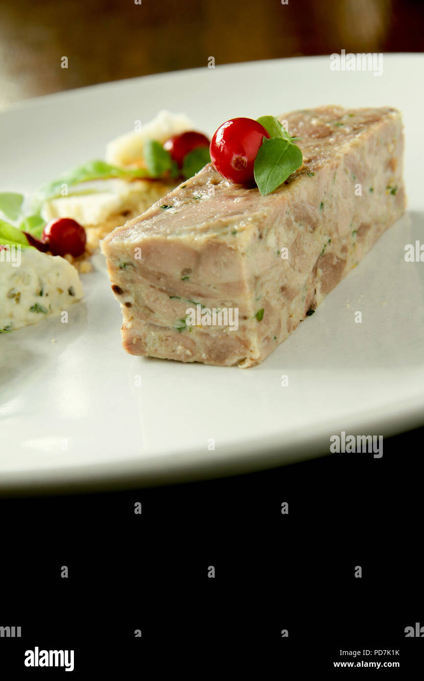 plated pork terrine starter with cranberries Stock Photo - Alamy