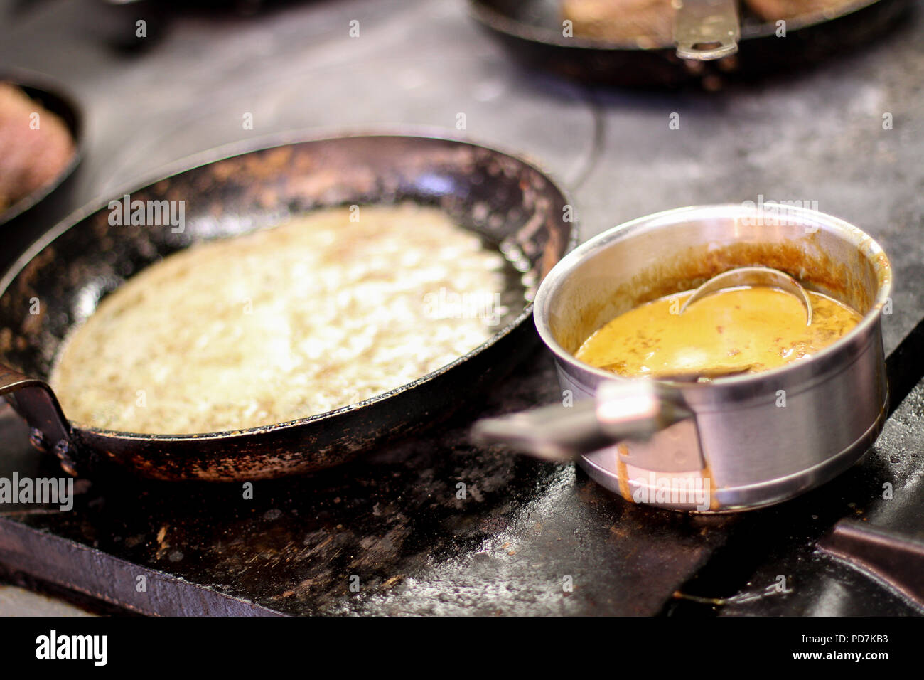 cooking fresh steak in kitchen Stock Photo - Alamy