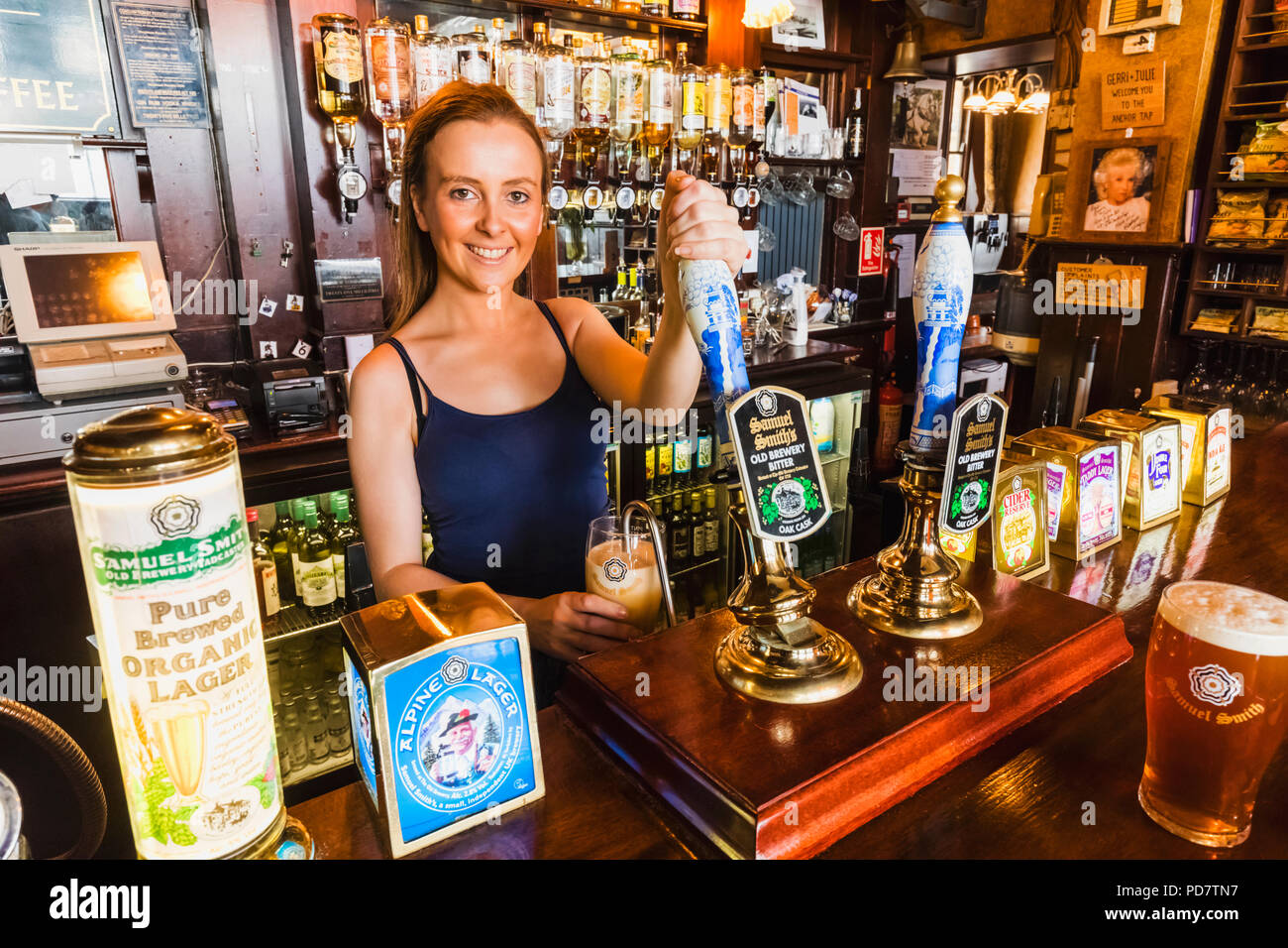 England, London, Southwark, Anchor Tap Pub, Barmaid Serving Beer Stock ...