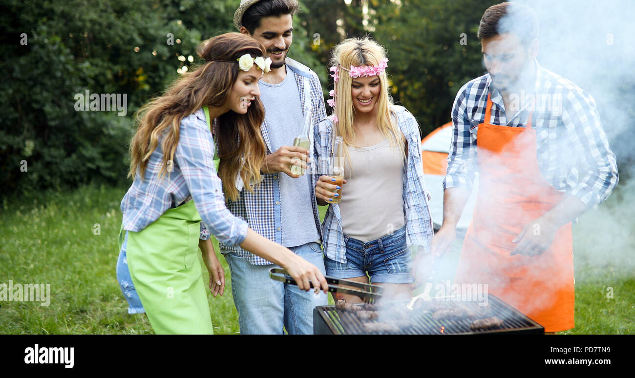 Friends enjoying bbq party Stock Photo - Alamy
