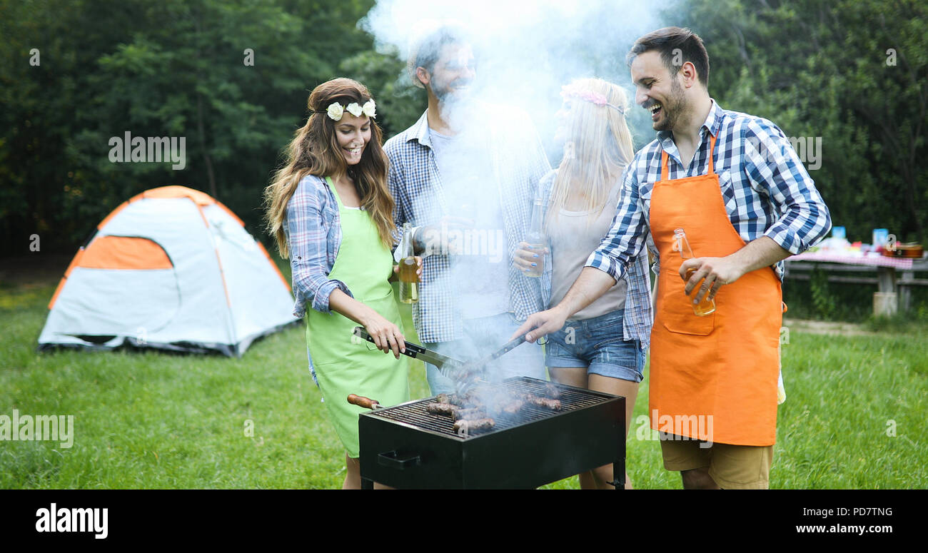Friends spending time in nature and having barbecue Stock Photo - Alamy