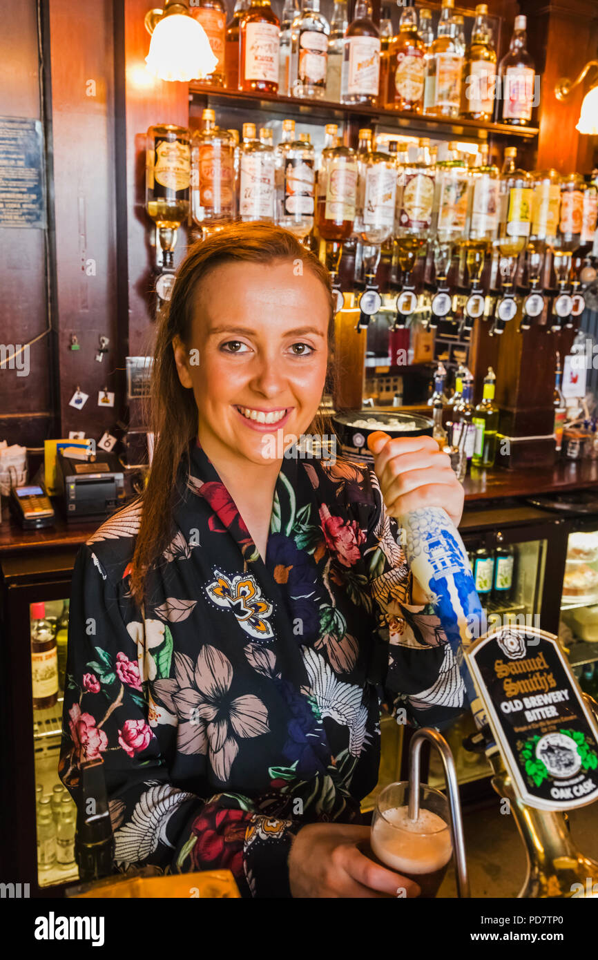 England, London, Southwark, Anchor Tap Pub, Barmaid Serving Beer Stock ...