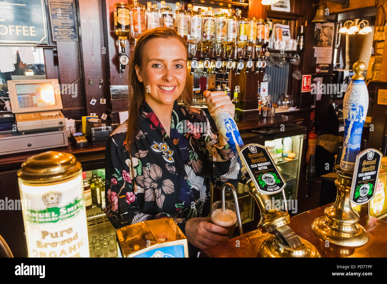 England, London, Southwark, Anchor Tap Pub, Barmaid Serving Beer Stock ...