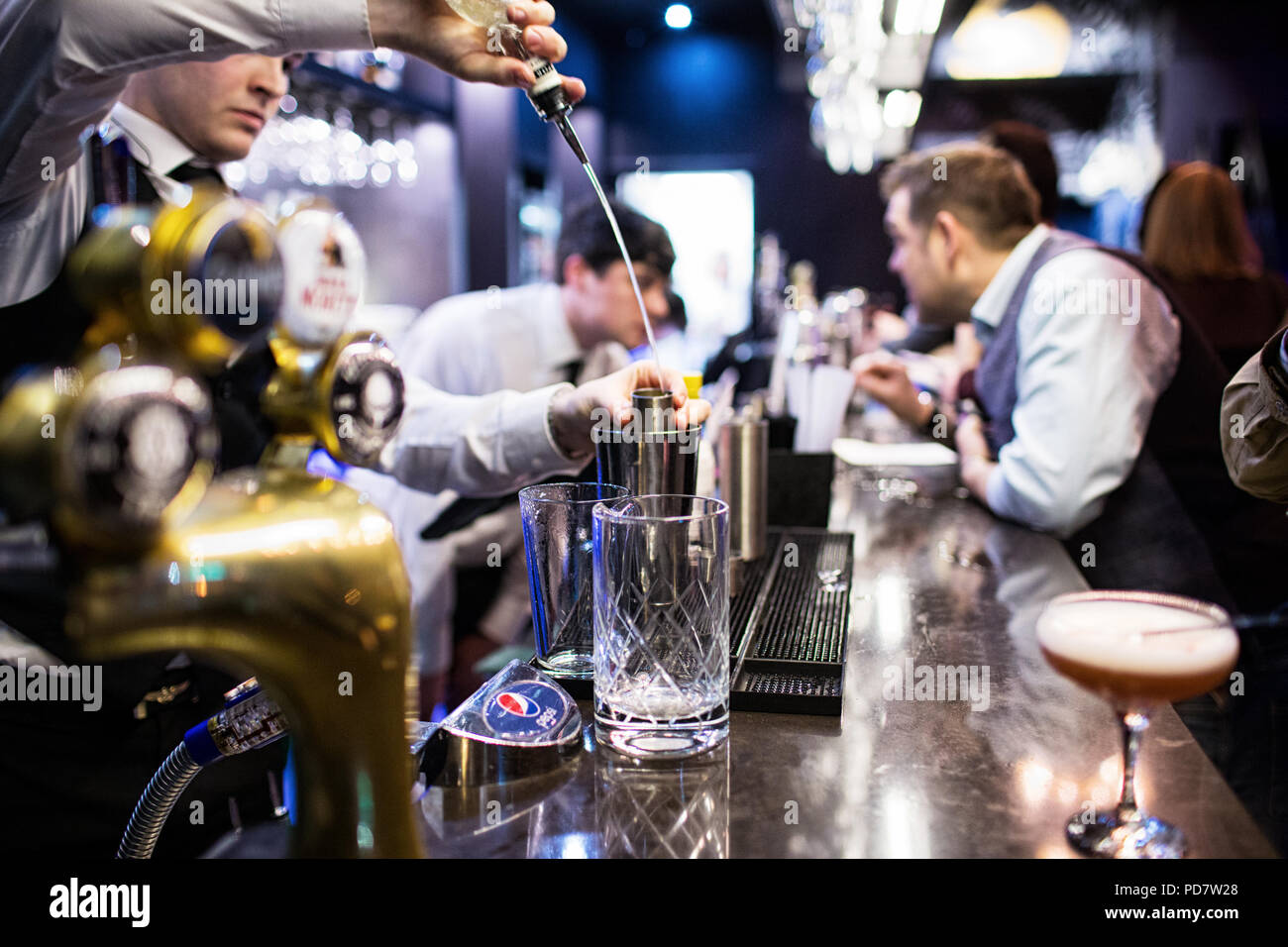 Bartender preparing drinks for customers hi-res stock photography and ...