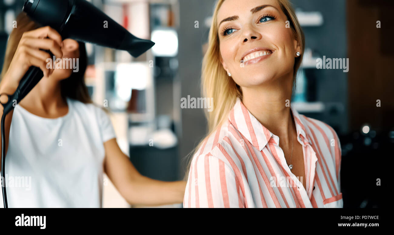 Happy woman at the hair salon Stock Photo - Alamy