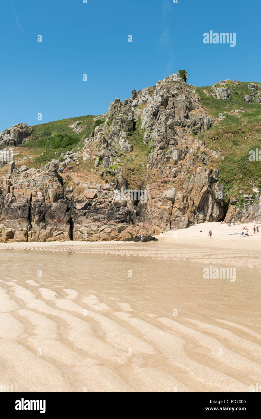 Holiday makers on the beach at Penn Vounder on the south coast of ...