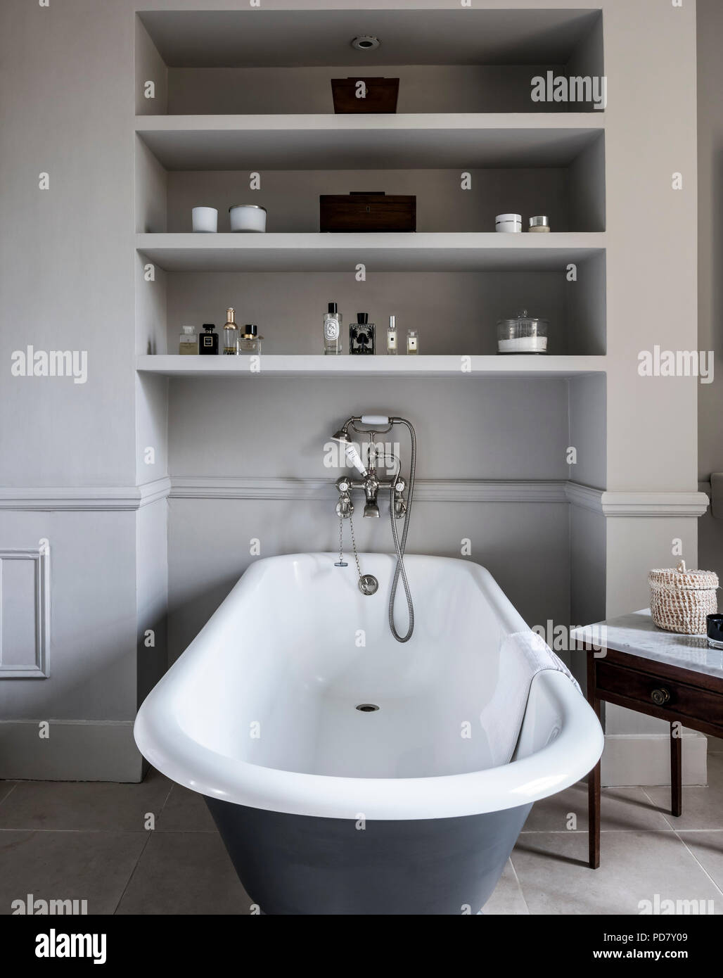 Free-standing roll top bath from Albion in bathroom with antique marble ...
