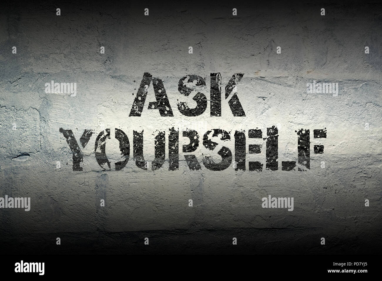 ask yourself stencil print on the grunge white brick wall Stock Photo ...