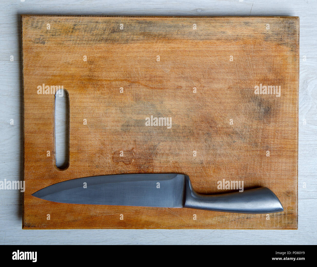 wood cutting board and sharp steel knife top view Stock Photo - Alamy