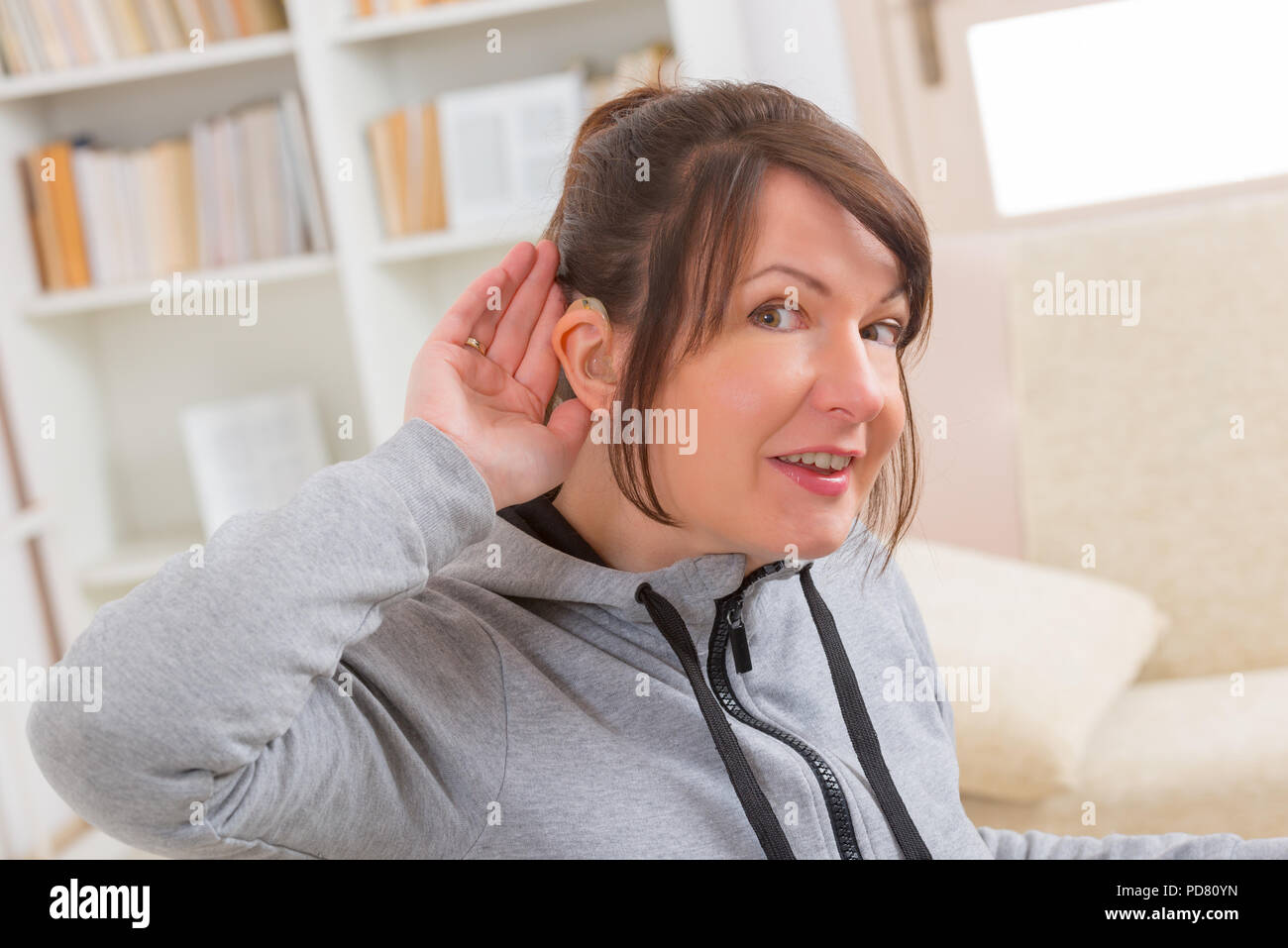Woman hearing aid hi-res stock photography and images - Alamy