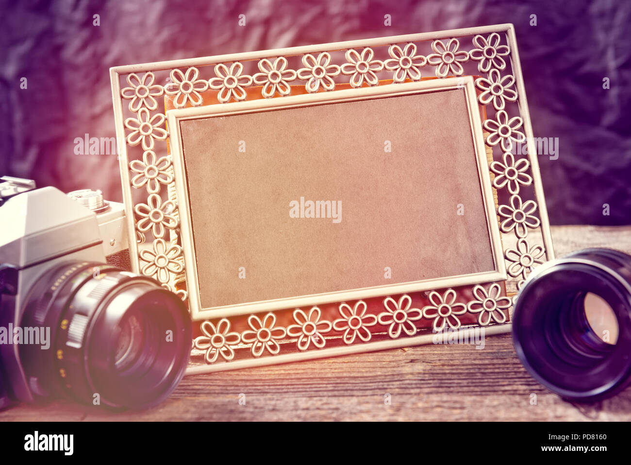 Old photographic cameras with photo frame on wooden desk Stock Photo ...