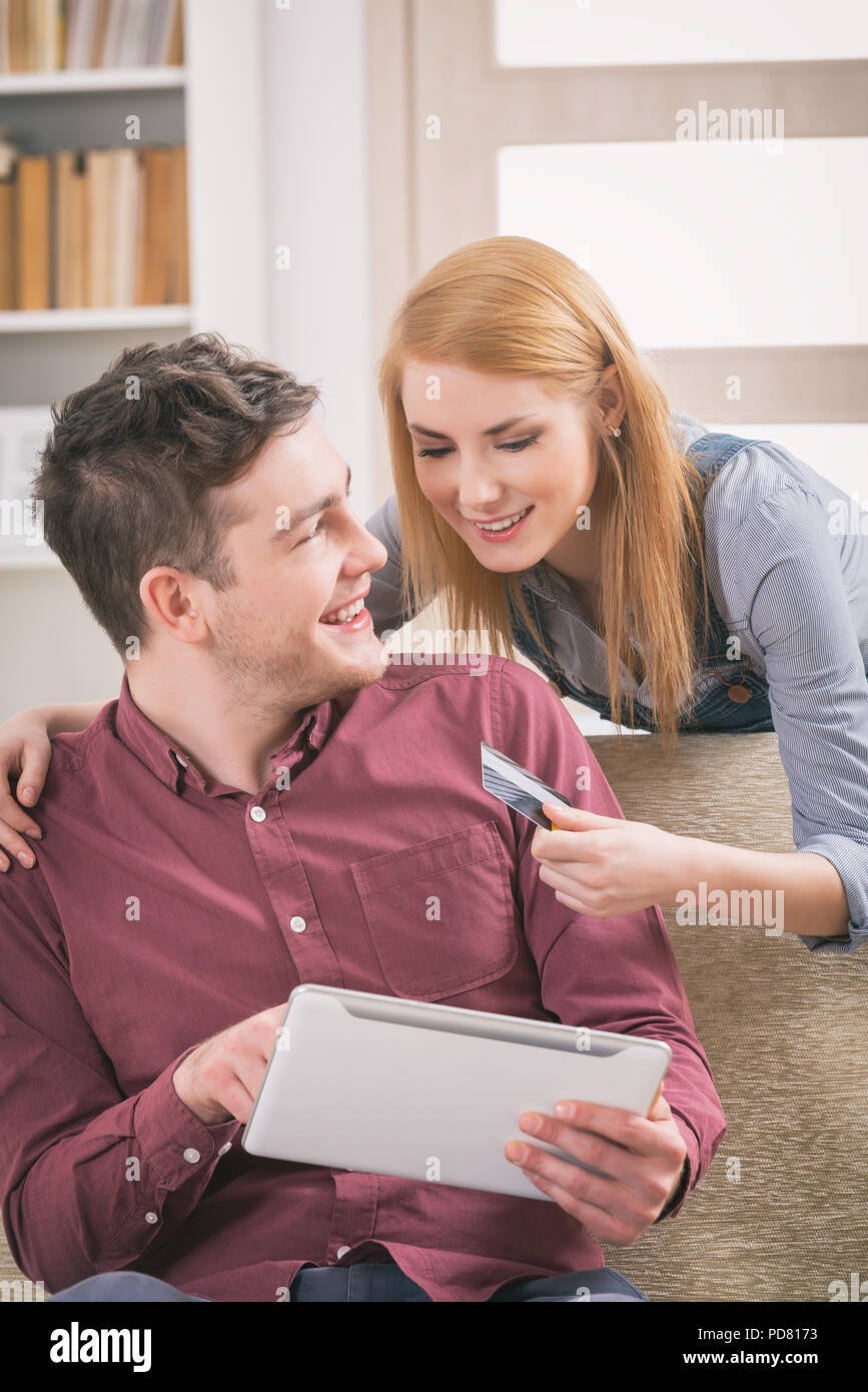 Happy couple doing on-line shopping with credit card Stock Photo - Alamy