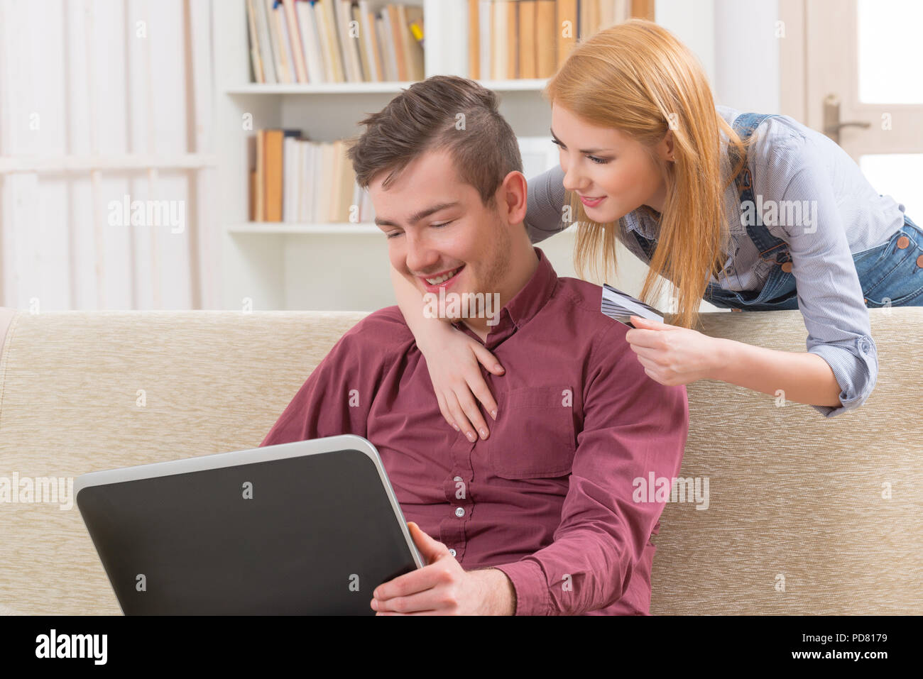 Happy couple doing on-line shopping with credit card Stock Photo - Alamy