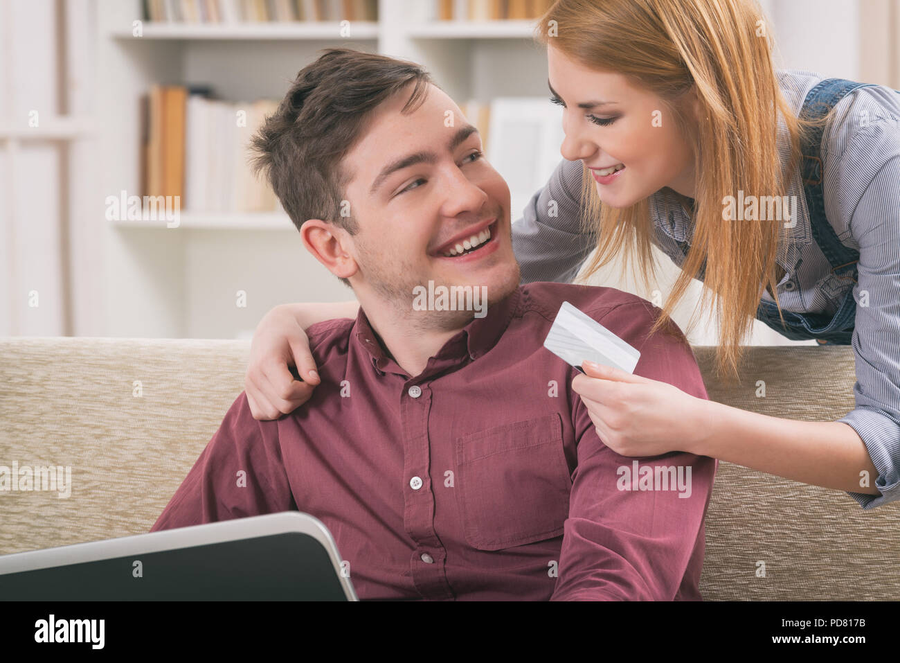 Happy couple doing on-line shopping with credit card Stock Photo - Alamy