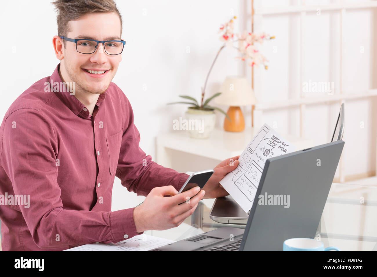 Designer or programmer working at new mobile applications Stock Photo ...