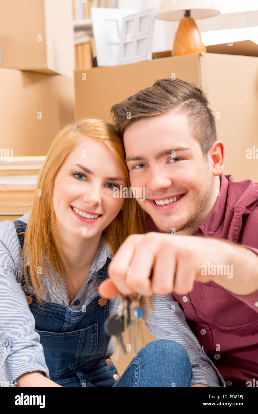 Happy couple celebrating their new home, keys in hand Stock Photo - Alamy
