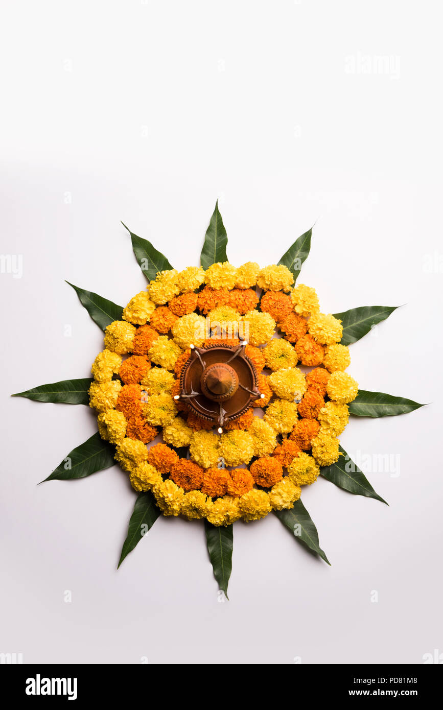 Flower Rangoli for Diwali or Pongal Festival made using Marigold or ...
