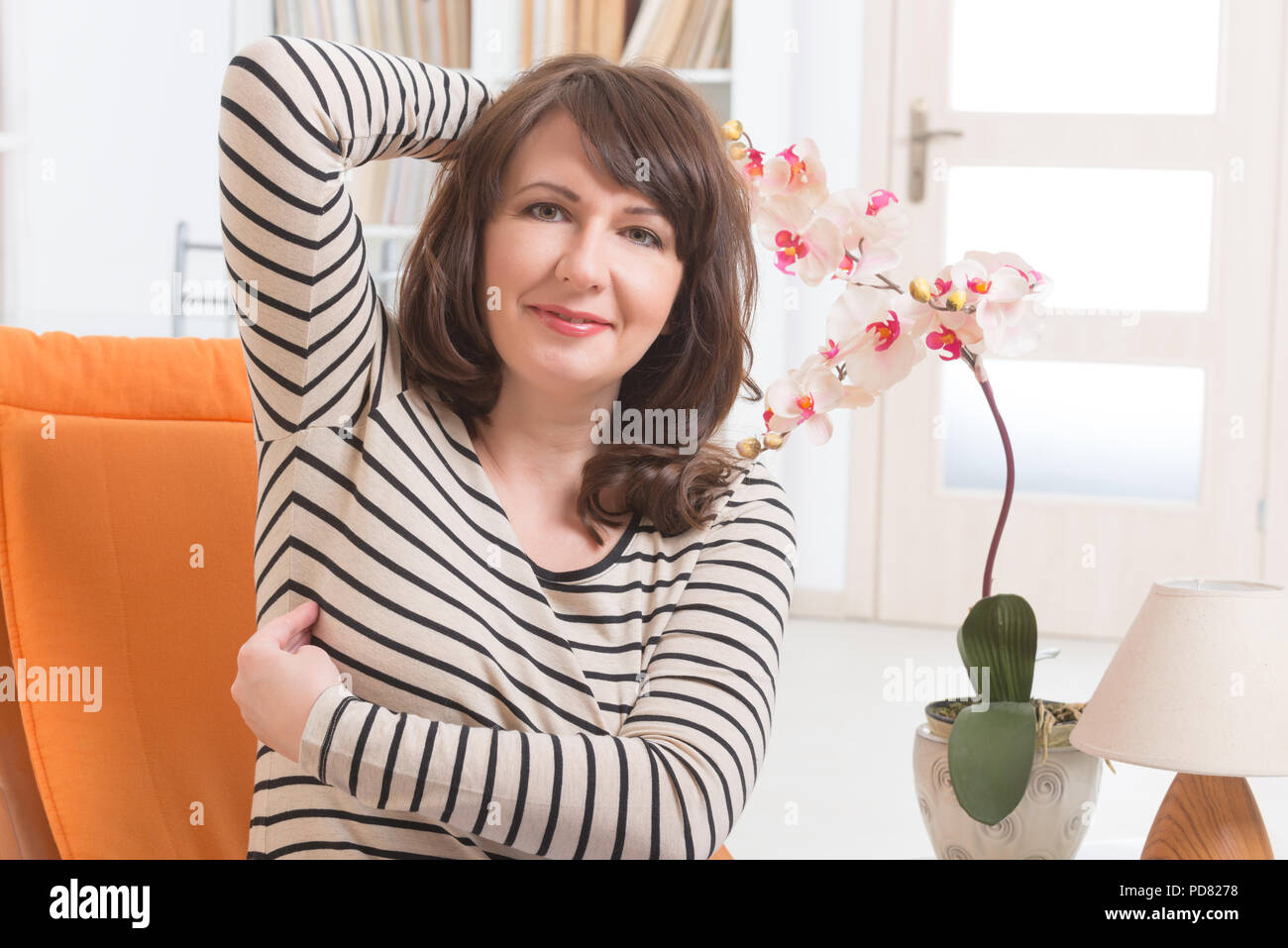 Woman doing EFT on the under arm point. Emotional Freedom Techniques ...