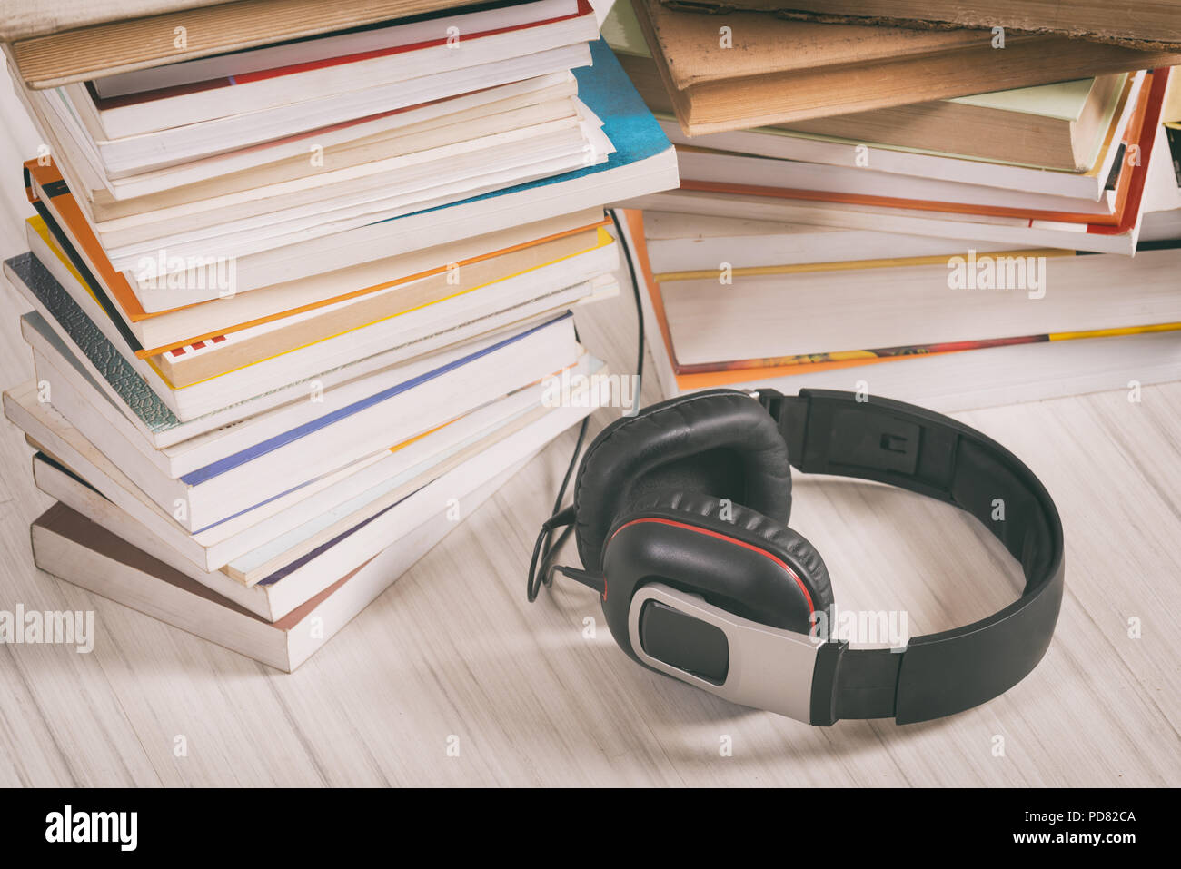 Stack of books with headphone hi-res stock photography and images - Alamy