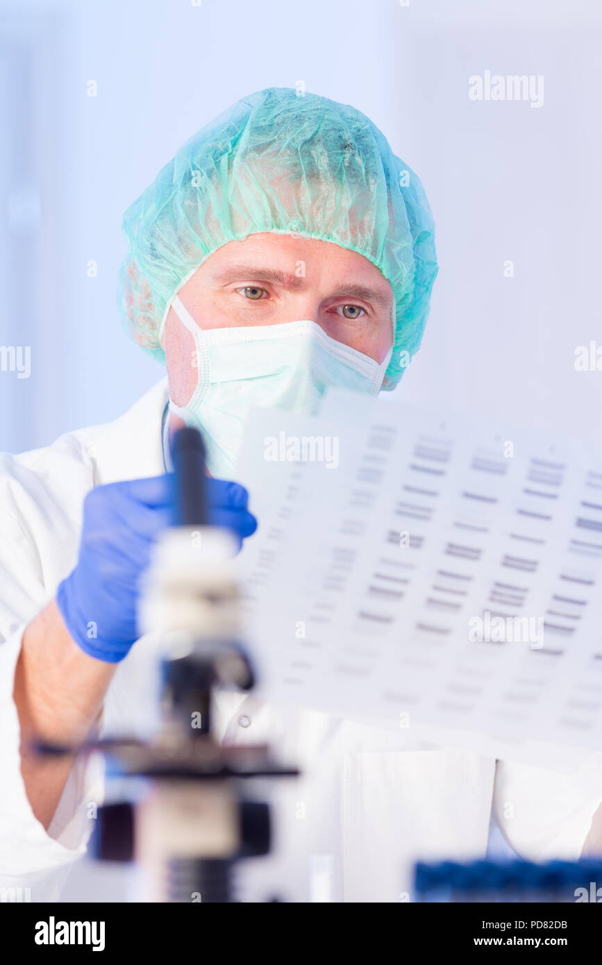 Scientist analizing DNA sequence Stock Photo - Alamy