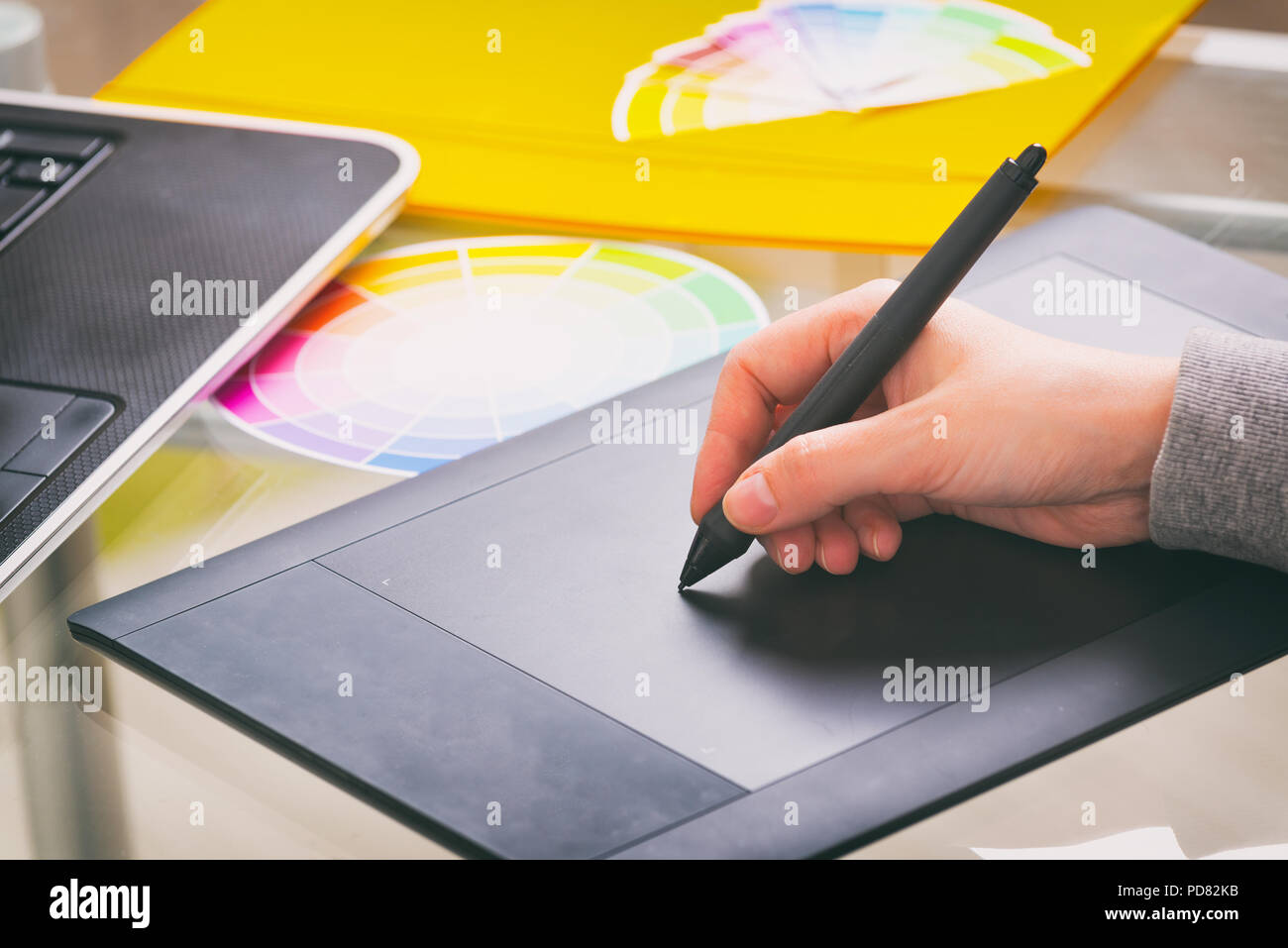 Designer using graphics tablet in the office Stock Photo - Alamy