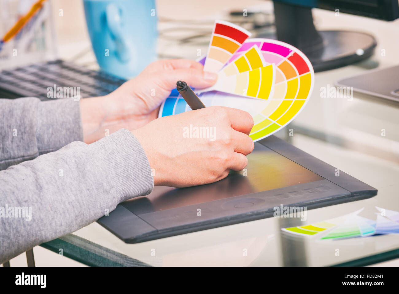 Designer using graphics tablet in the office Stock Photo - Alamy