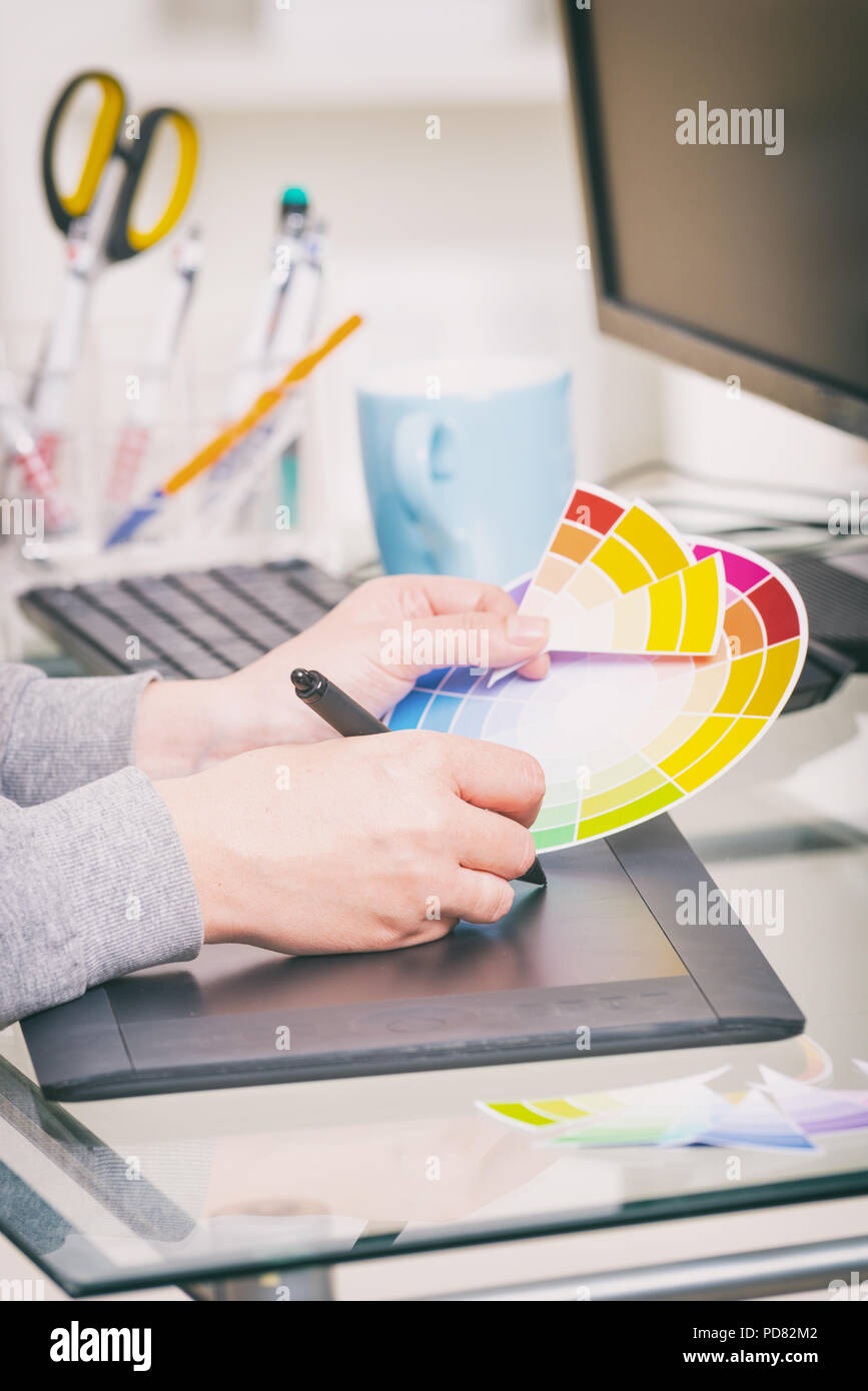 Designer using graphics tablet in the office Stock Photo - Alamy