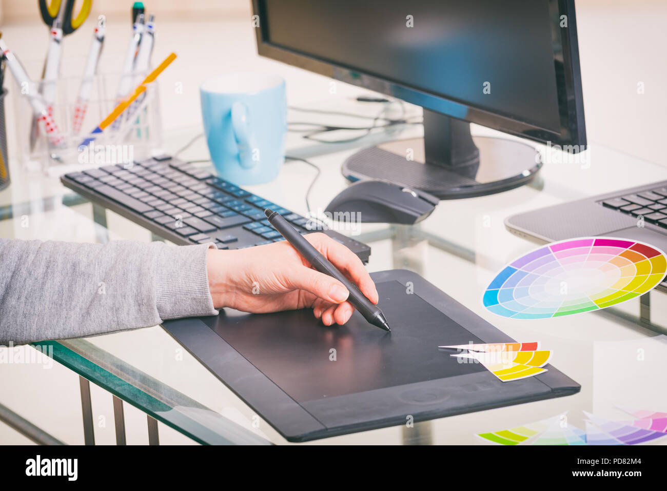 Designer using graphics tablet in the office Stock Photo - Alamy