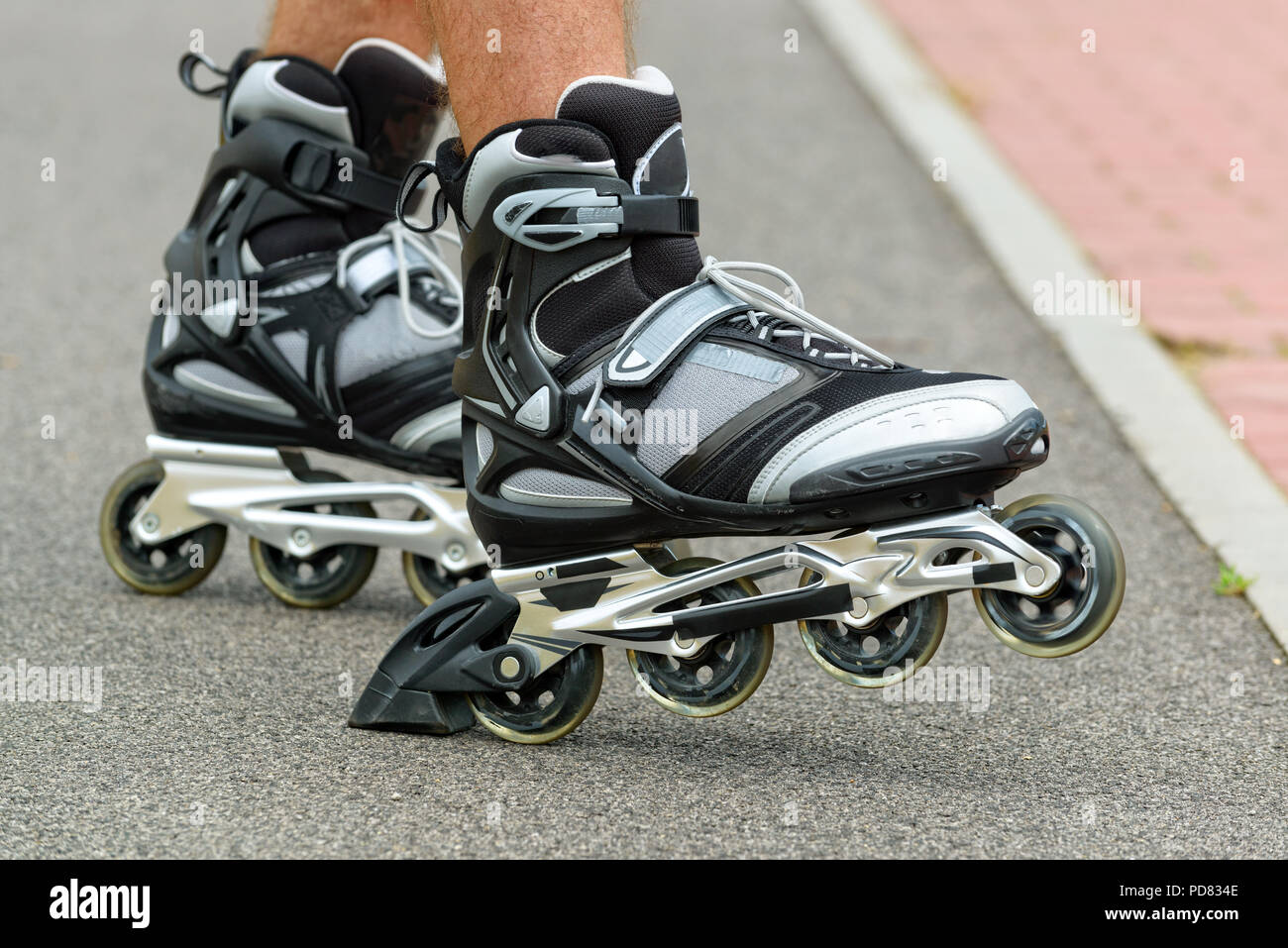 Roller blading outdoors, male legs Stock Photo - Alamy