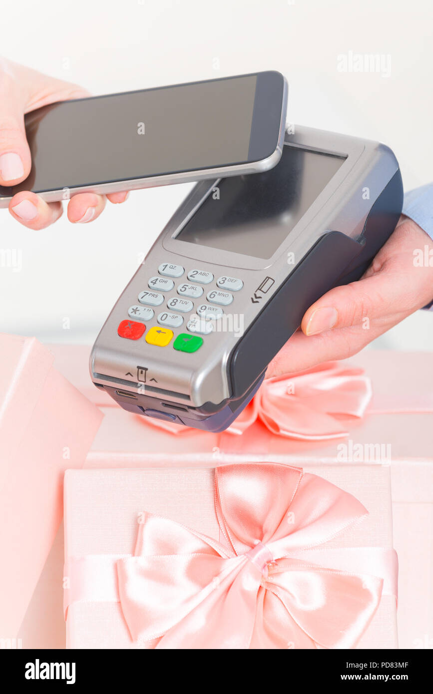 Making contactless payment for a gifts with smart phone over payment ...