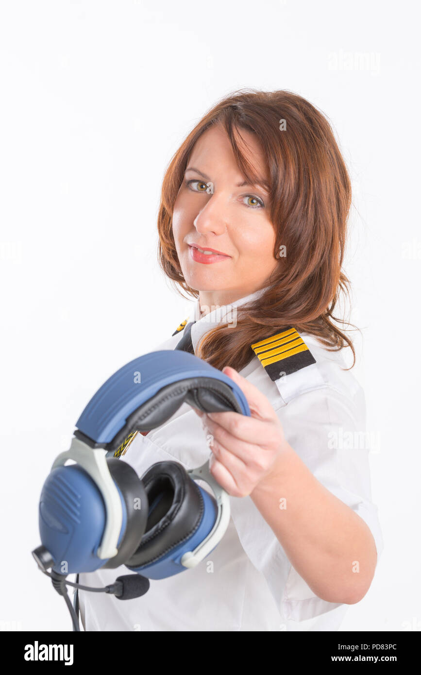 Beautiful woman pilot with headset used in aircraft Stock Photo - Alamy
