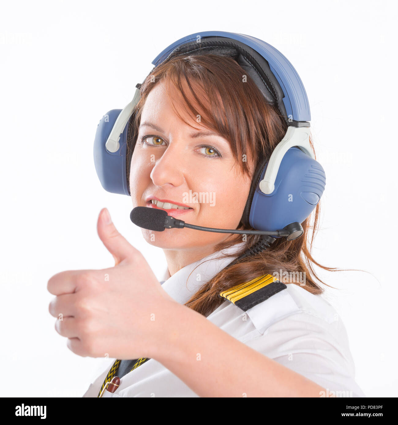 Beautiful woman pilot with headset used in aircraft Stock Photo - Alamy