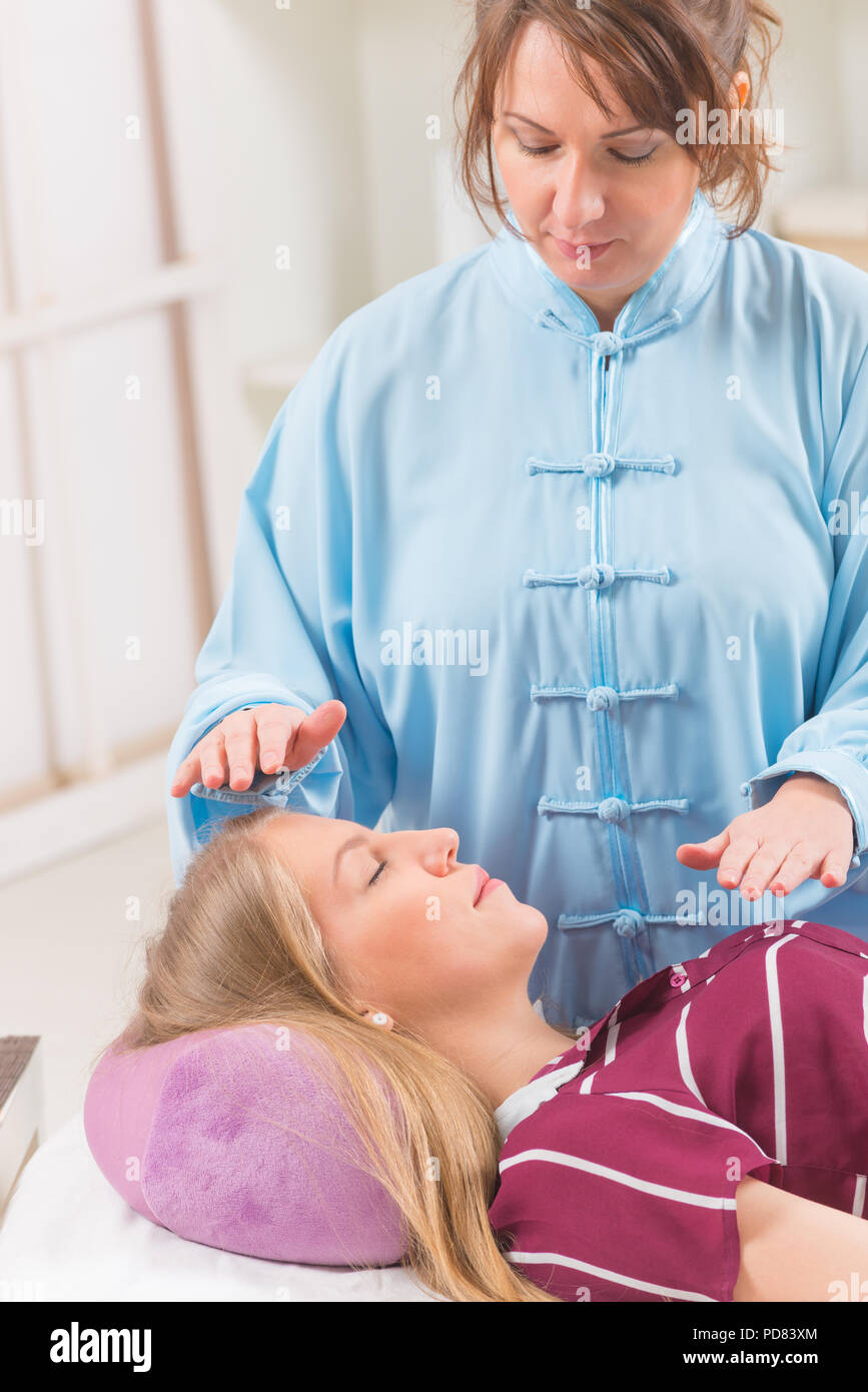 Reiki laying hi-res stock photography and images - Alamy