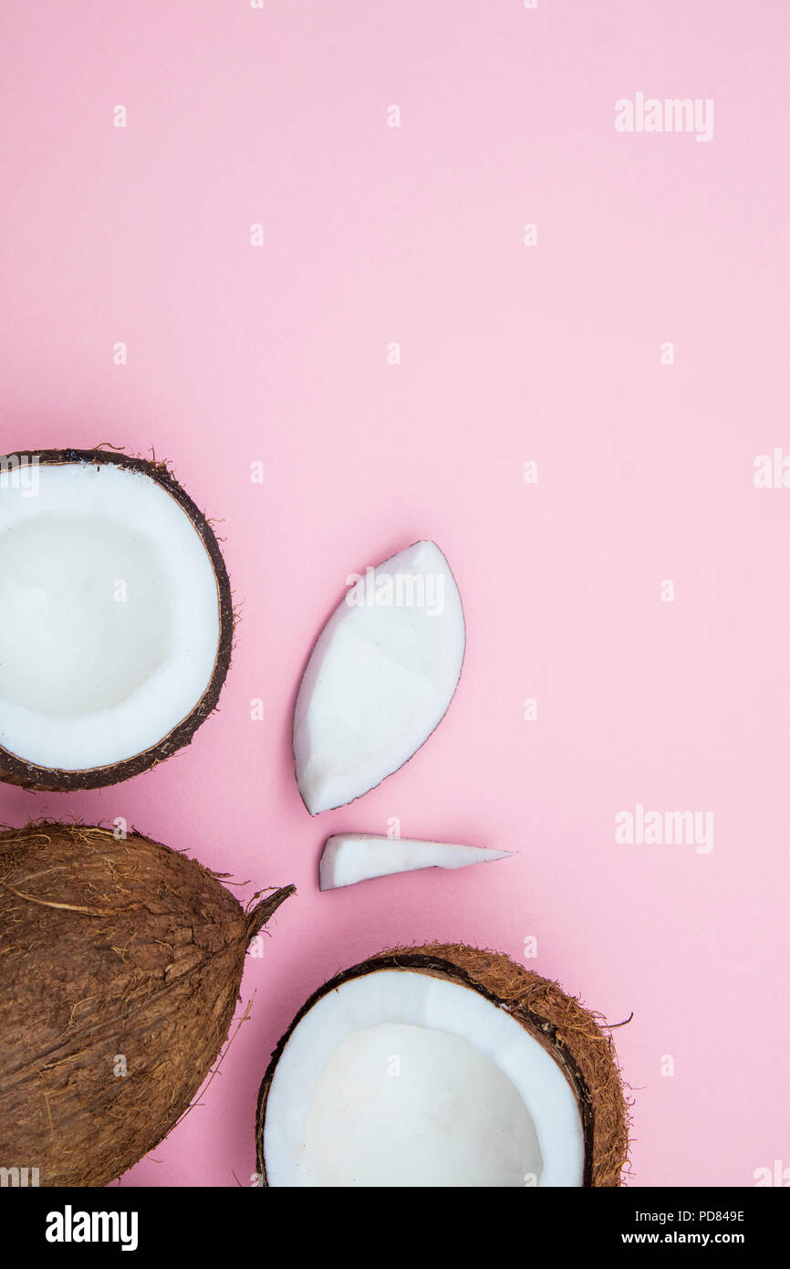 Tropical summer coconut on a pastel pink background Stock Photo - Alamy